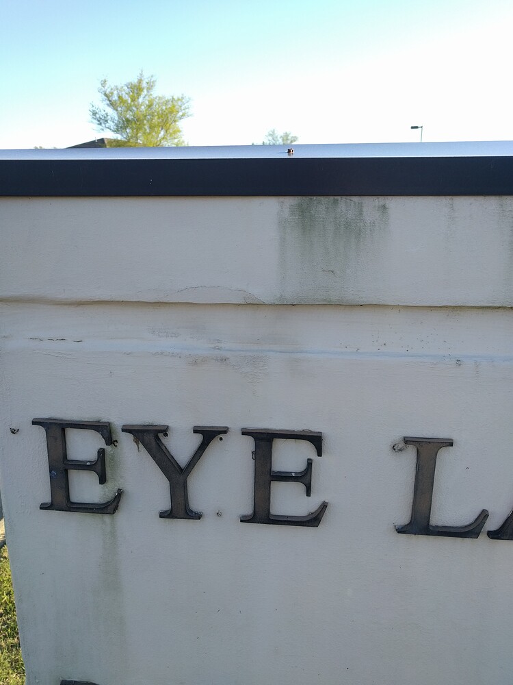 Stucco sign with metal lettering - Commercial - Pressure Washing Resource