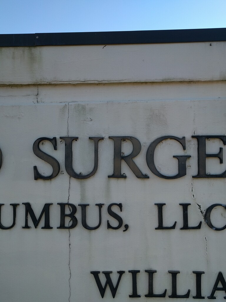 Stucco sign with metal lettering - Commercial - Pressure Washing Resource
